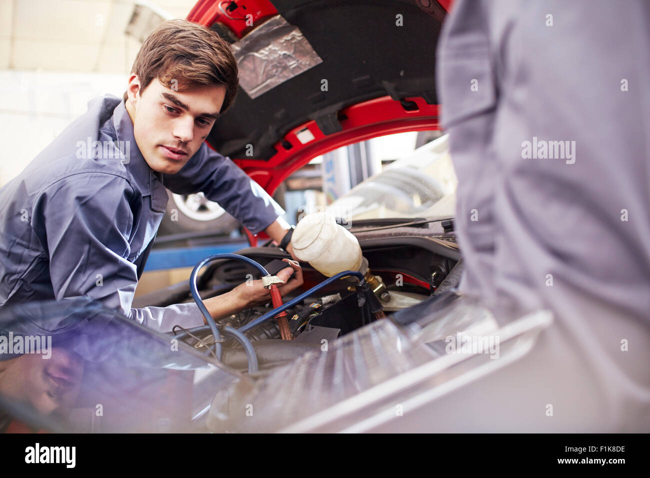 Mechanic working on car hi-res stock photography and images - Alamy