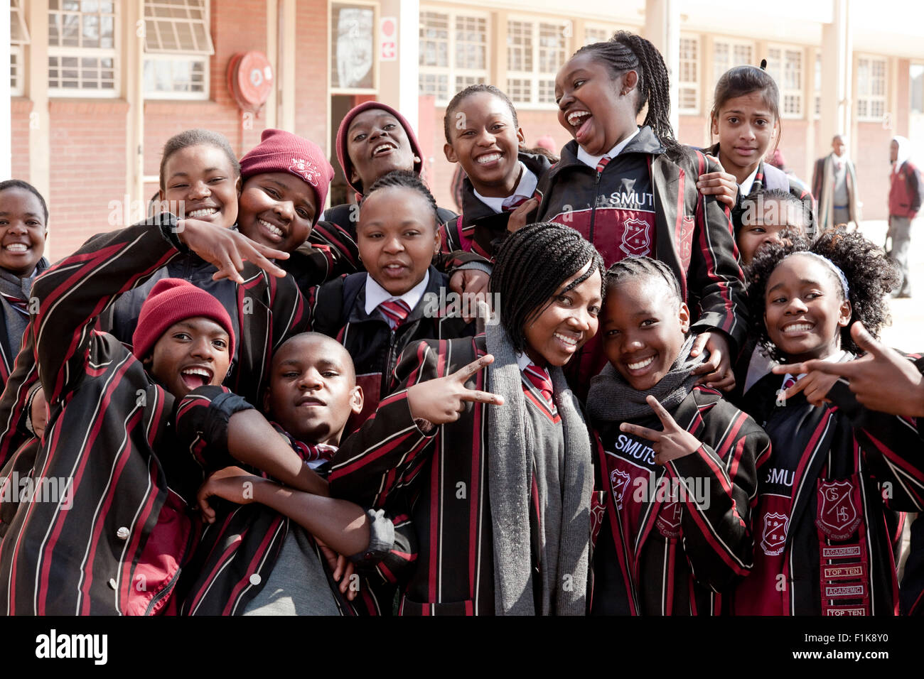 A group of high school friends smile at the camera Stock Photo - Alamy