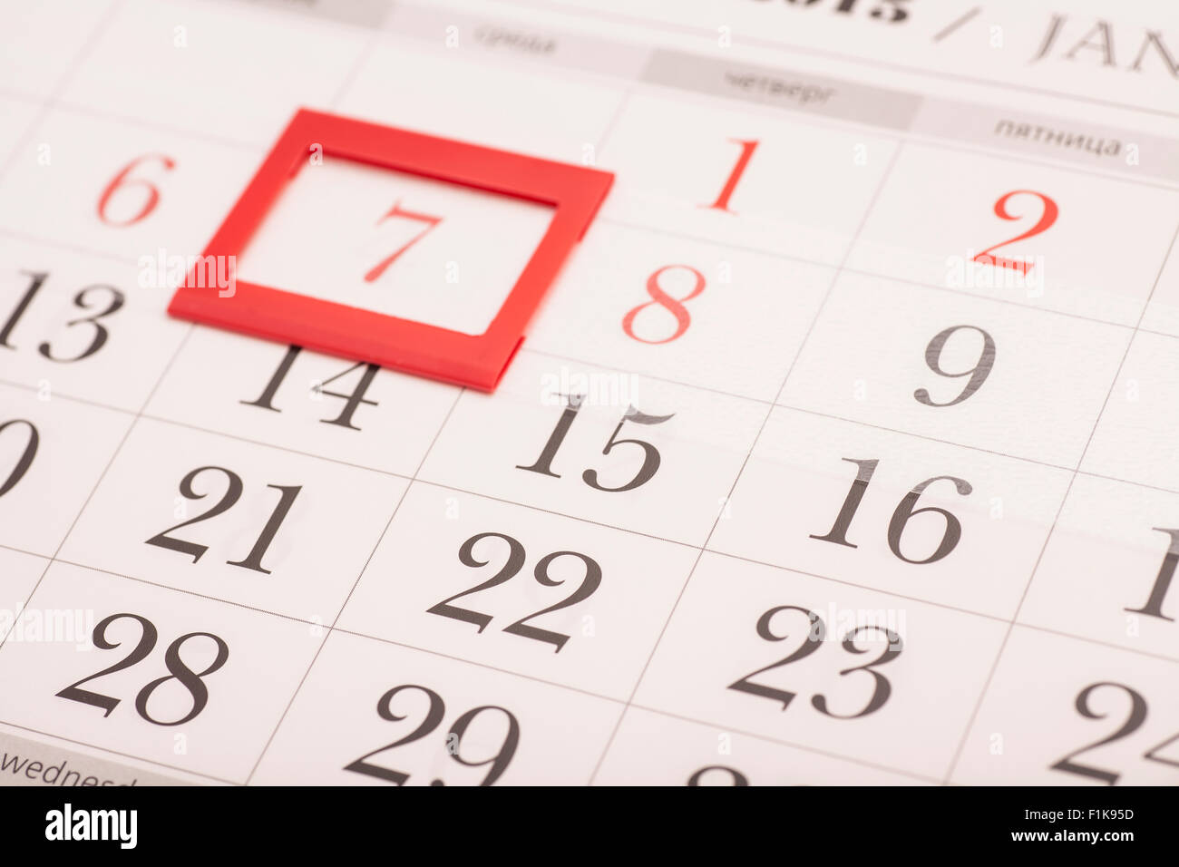 Sheet of wall calendar with red mark on framed date 7 Stock Photo - Alamy