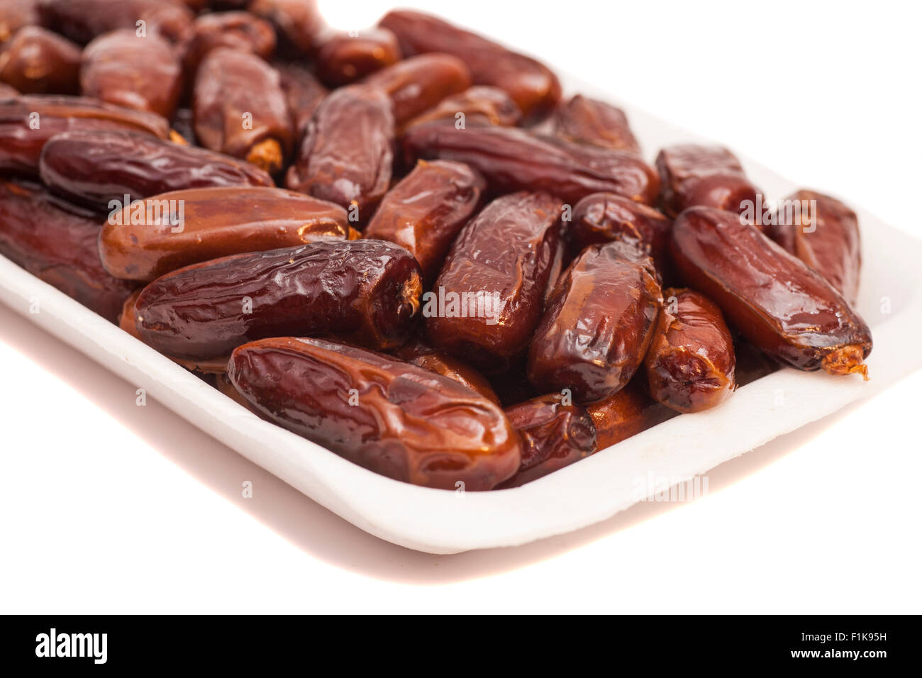 Dates isolated on white background Stock Photo - Alamy