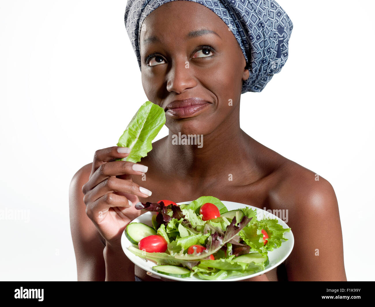 African woman eating a salad Stock Photo - Alamy