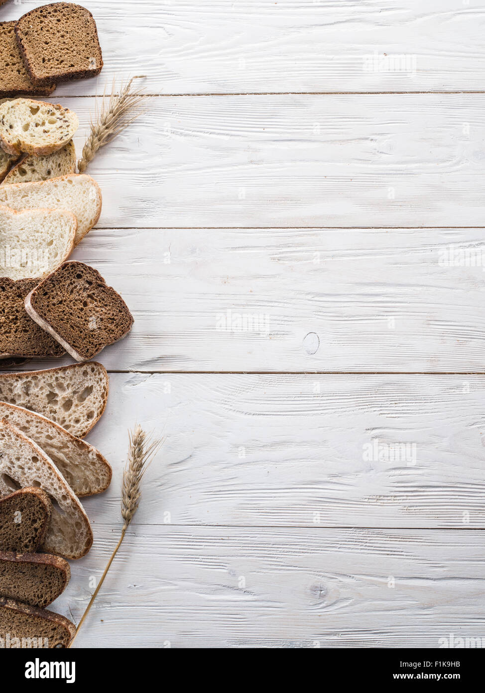 Different types of bread arranged as a frame on left side Stock Photo ...