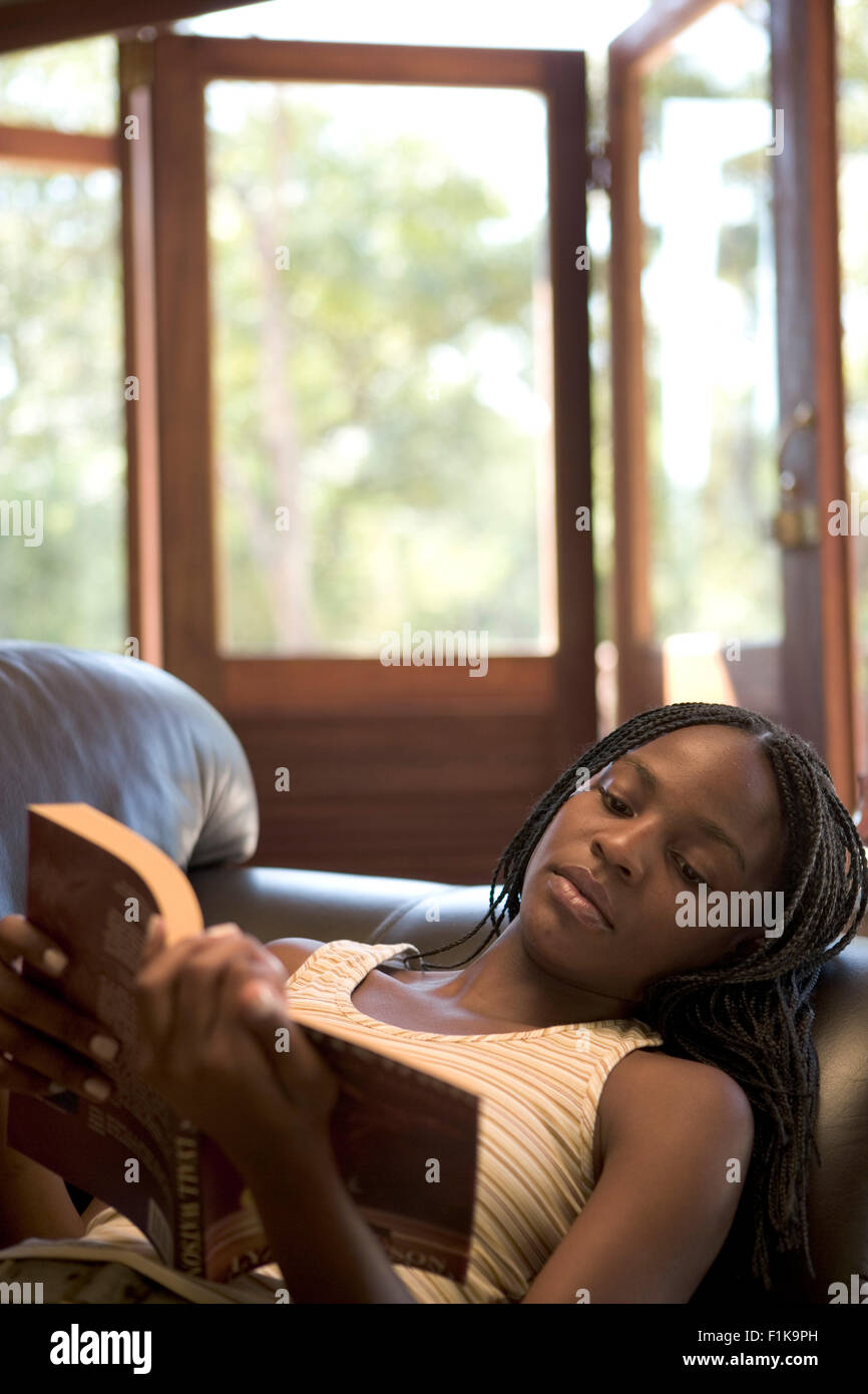 African woman reading a book Stock Photo - Alamy