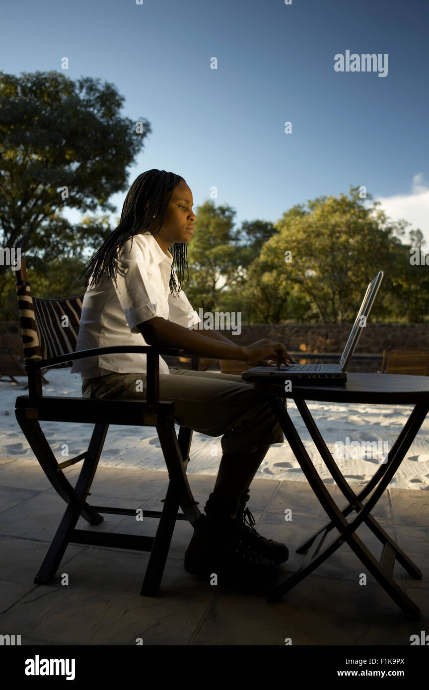 African woman working on laptop Stock Photo - Alamy