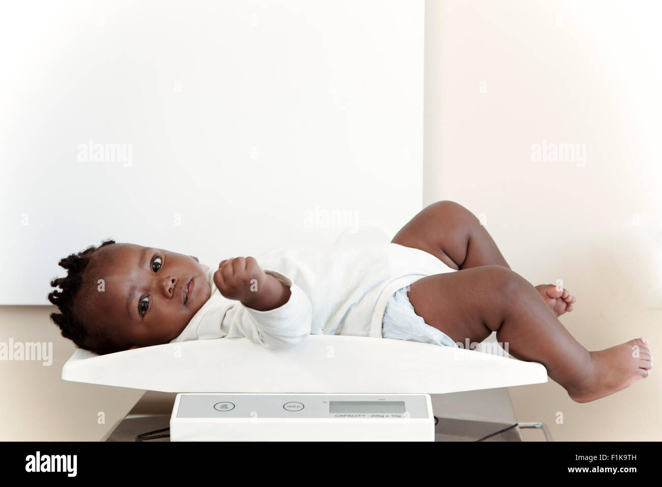 African infant lying on a ward bed in a clinic Stock Photo - Alamy