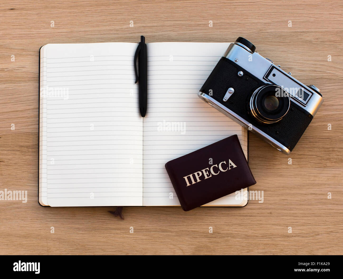 Russian Press card, open a Notepad, pen and a film camera, a top view ...