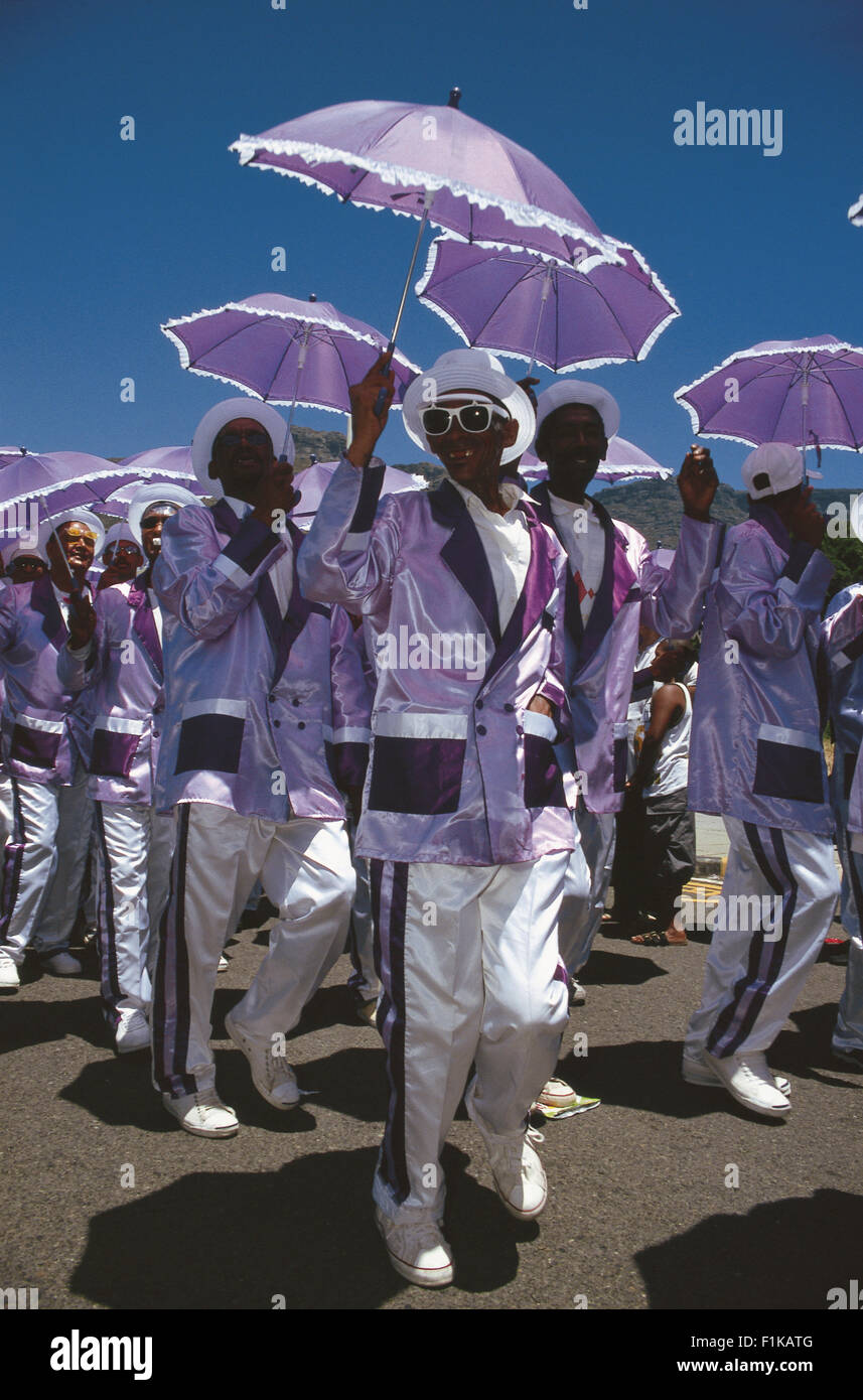 Cape Minstrels dancing in street parade with purple umbrellas. Cape ...