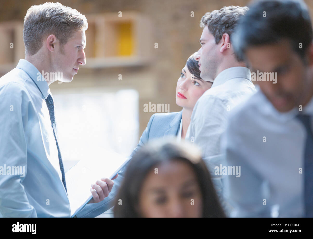 Serious business people talking in office Stock Photo - Alamy
