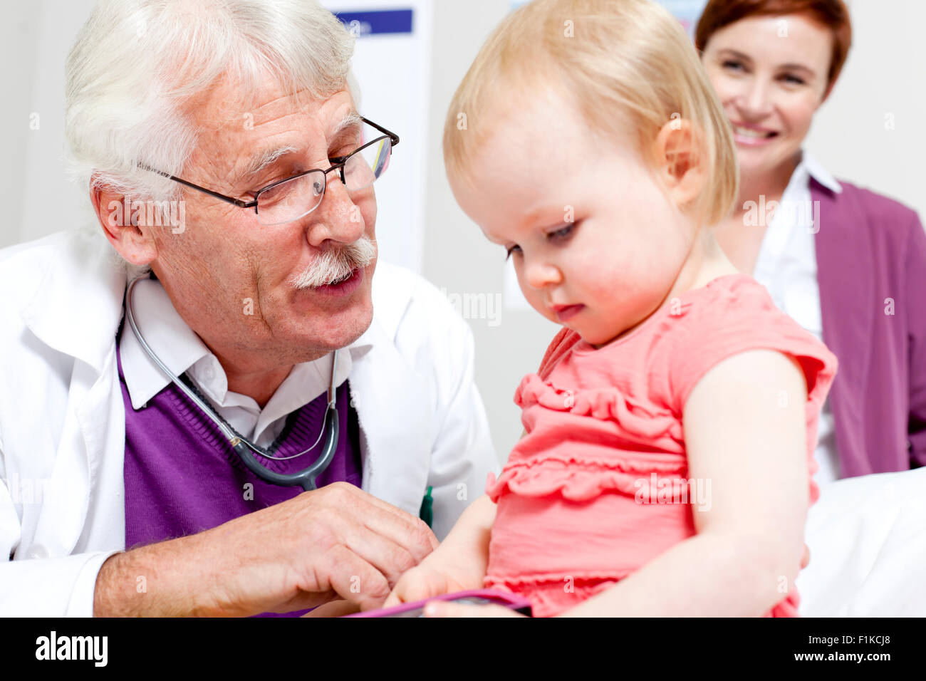 A paediatrician with a baby Stock Photo - Alamy