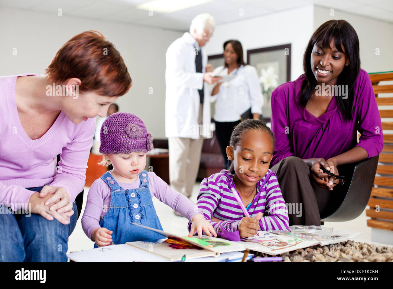 Two families in the waiting room Stock Photo - Alamy