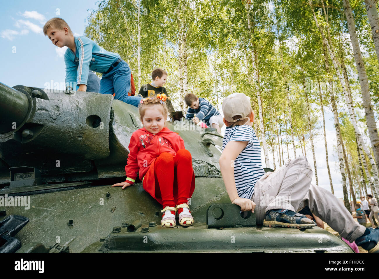 SVIETLAHORSK, BELARUS - JUNE 21, 2014: Children climb on Soviet tank ...