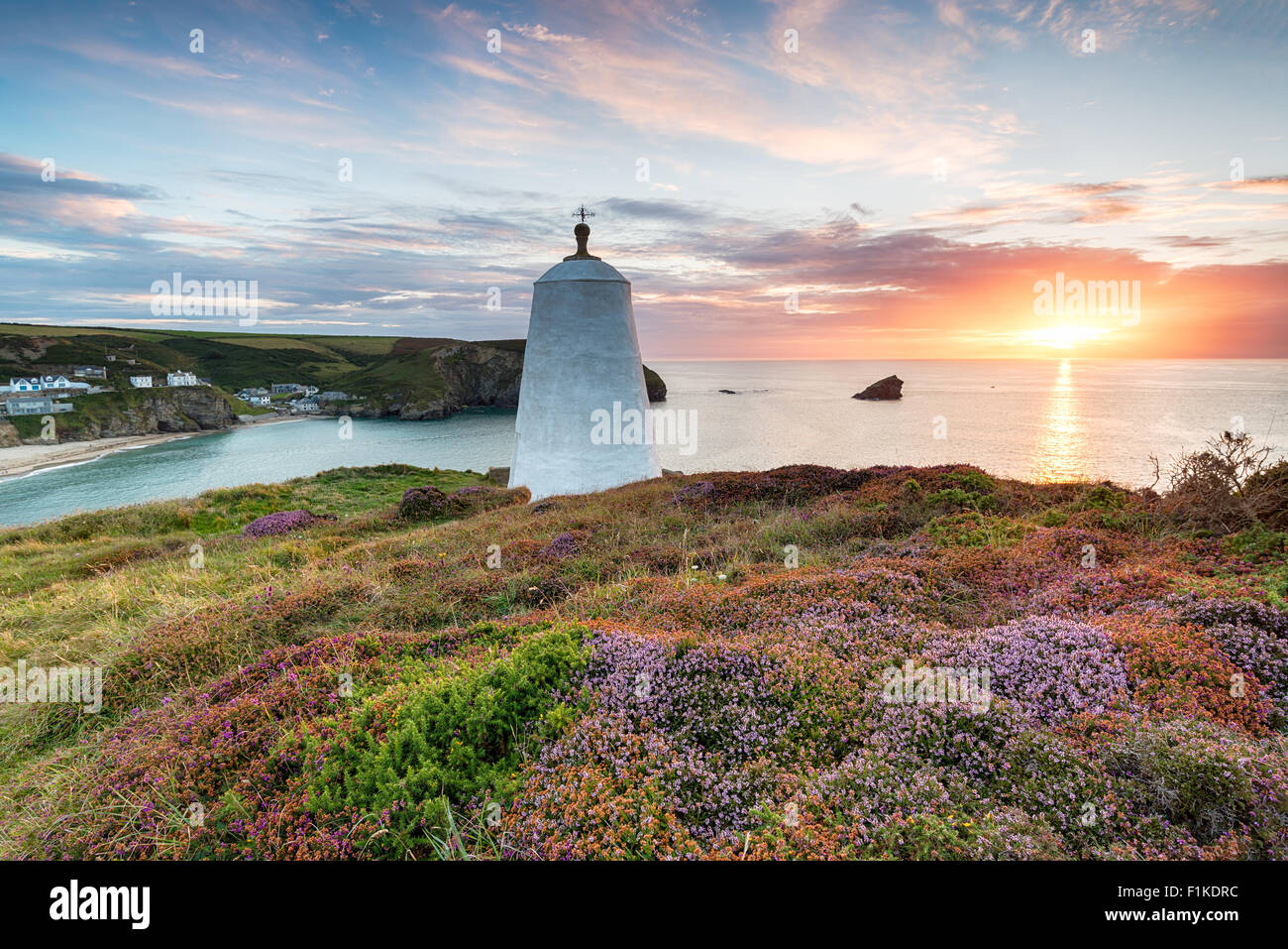 Beautiful sunset over the Pepperpot lighthouse at Portreath in a carpet ...