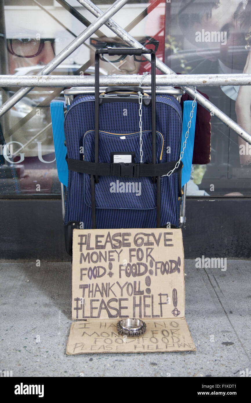 Hungry homeless person sets up sidewalk display where passersby can ...