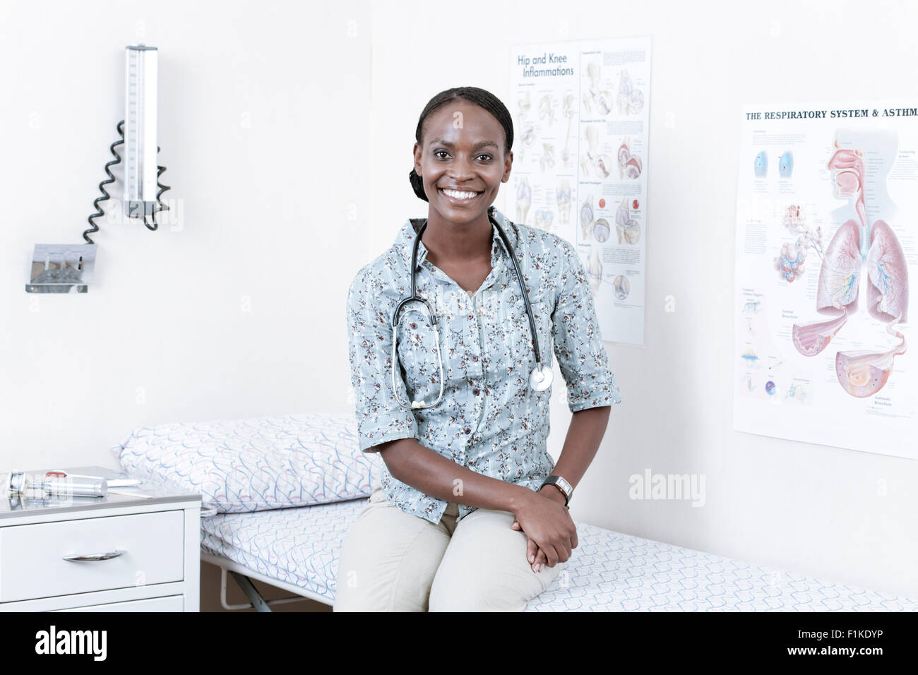Female African doctor looking at camera, smiling Stock Photo - Alamy