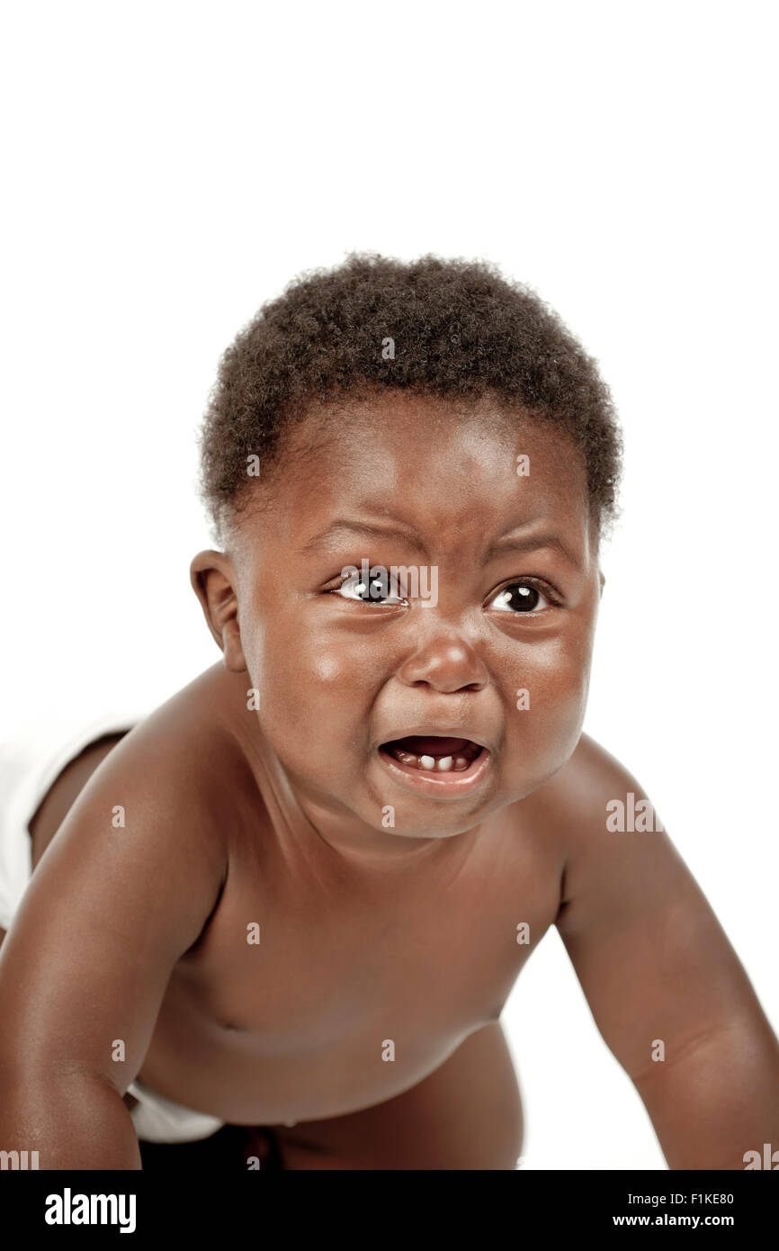 An infant sitting in front of a white background Stock Photo - Alamy