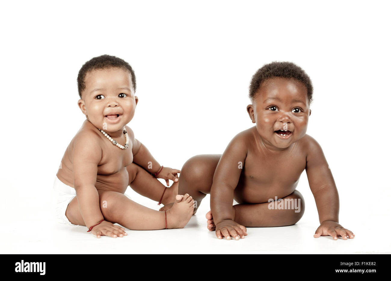 Cute baby smiling sitting in Cut Out Stock Images & Pictures - Alamy