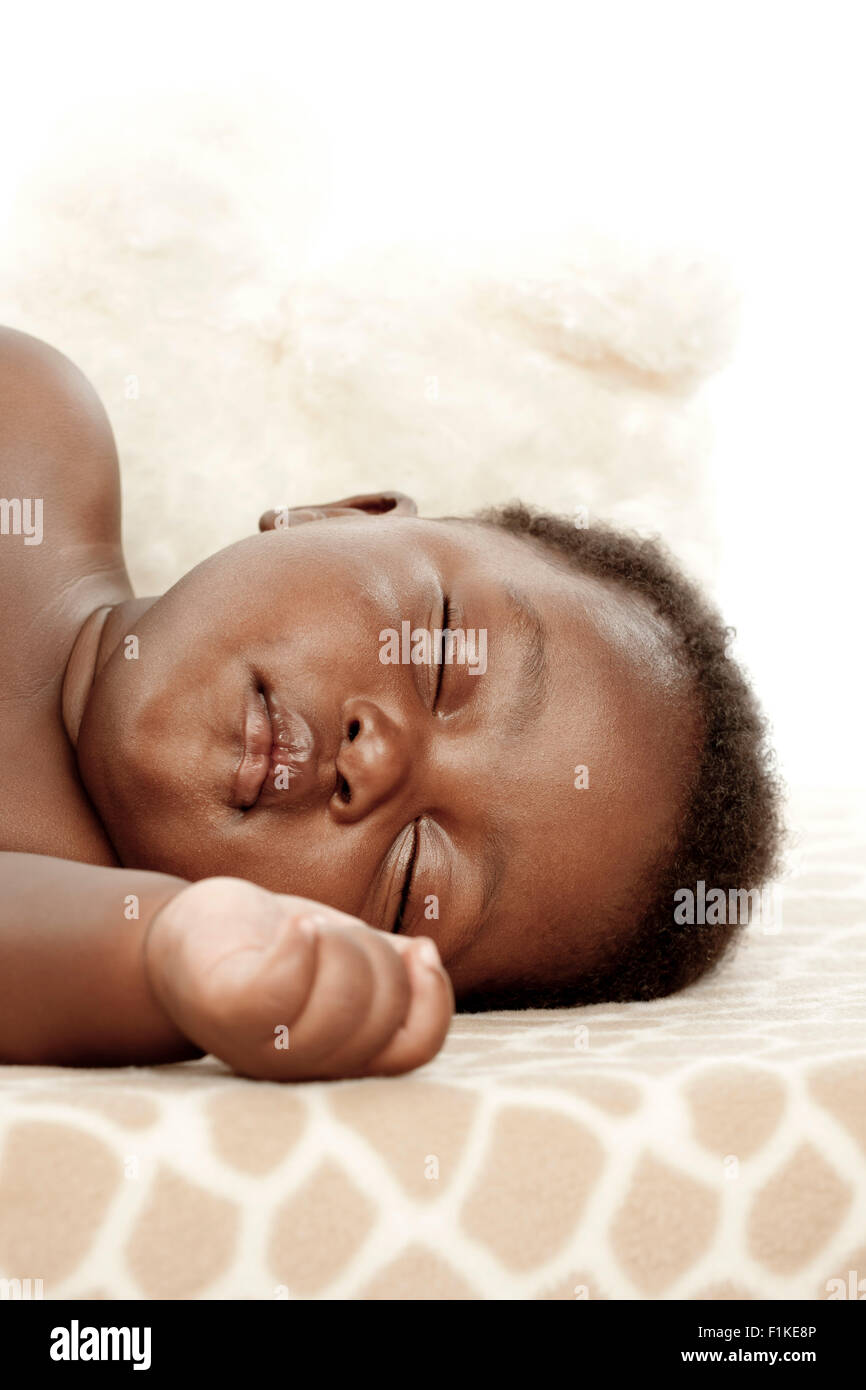An infant sleeping on a blanket, headshot Stock Photo - Alamy