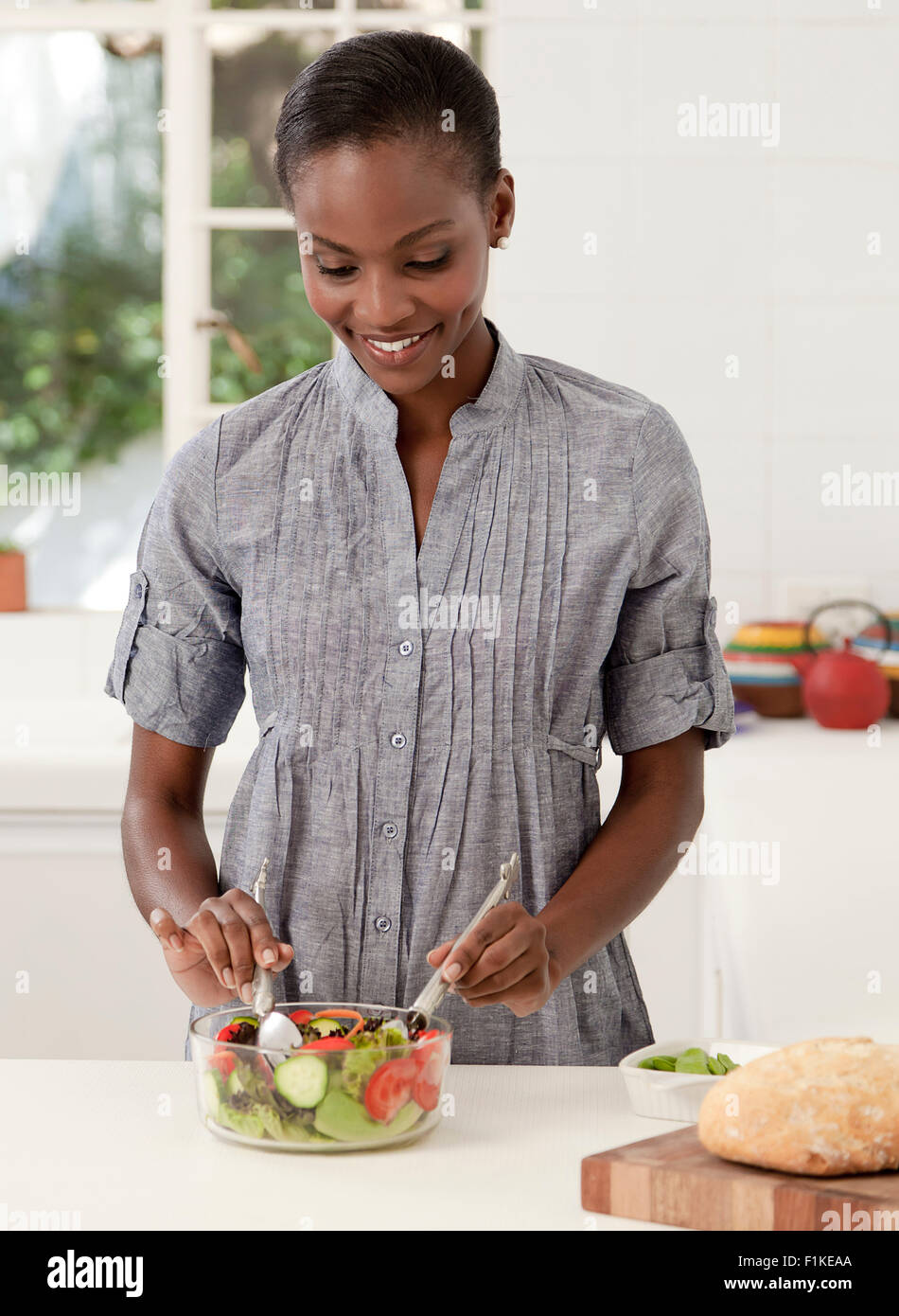 Young african mother making food hi-res stock photography and images ...