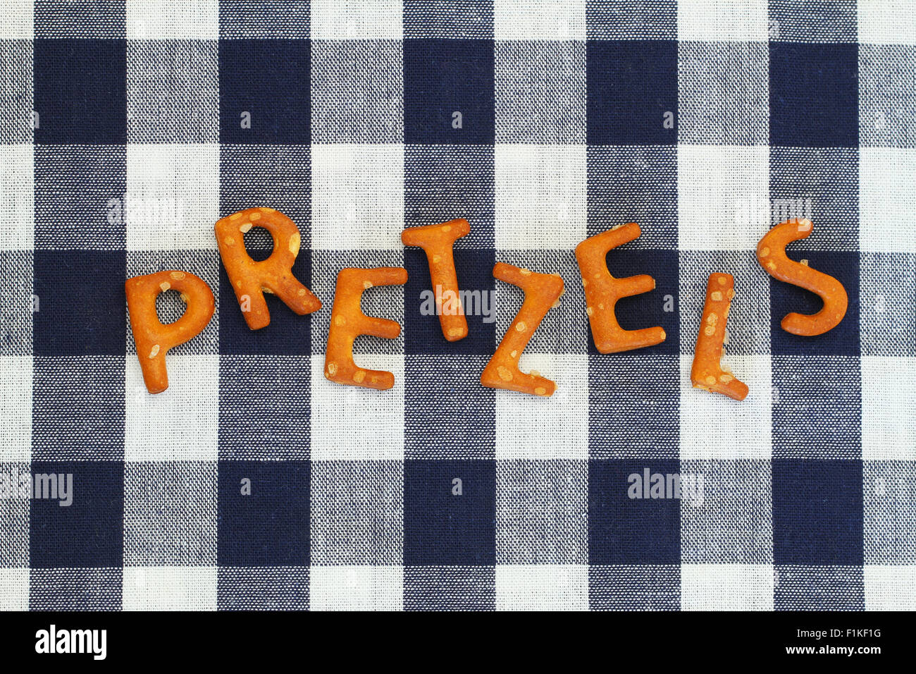 Word pretzels written with pretzel-like letters on checkered cloth ...