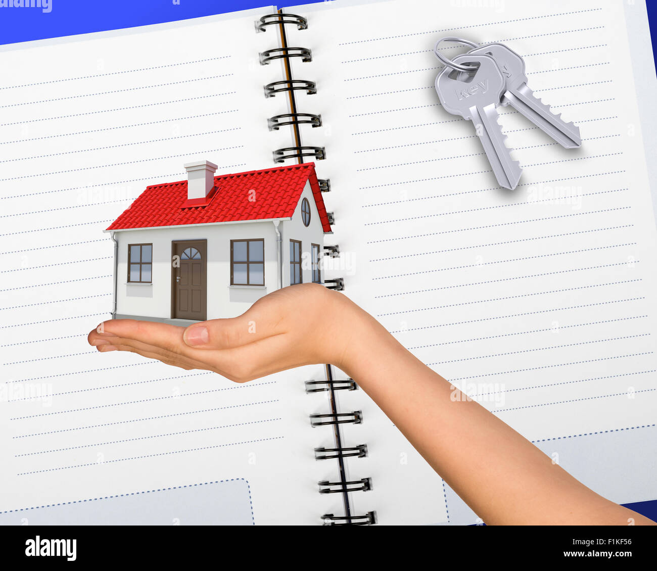 Humans hand holding house with keys Stock Photo - Alamy