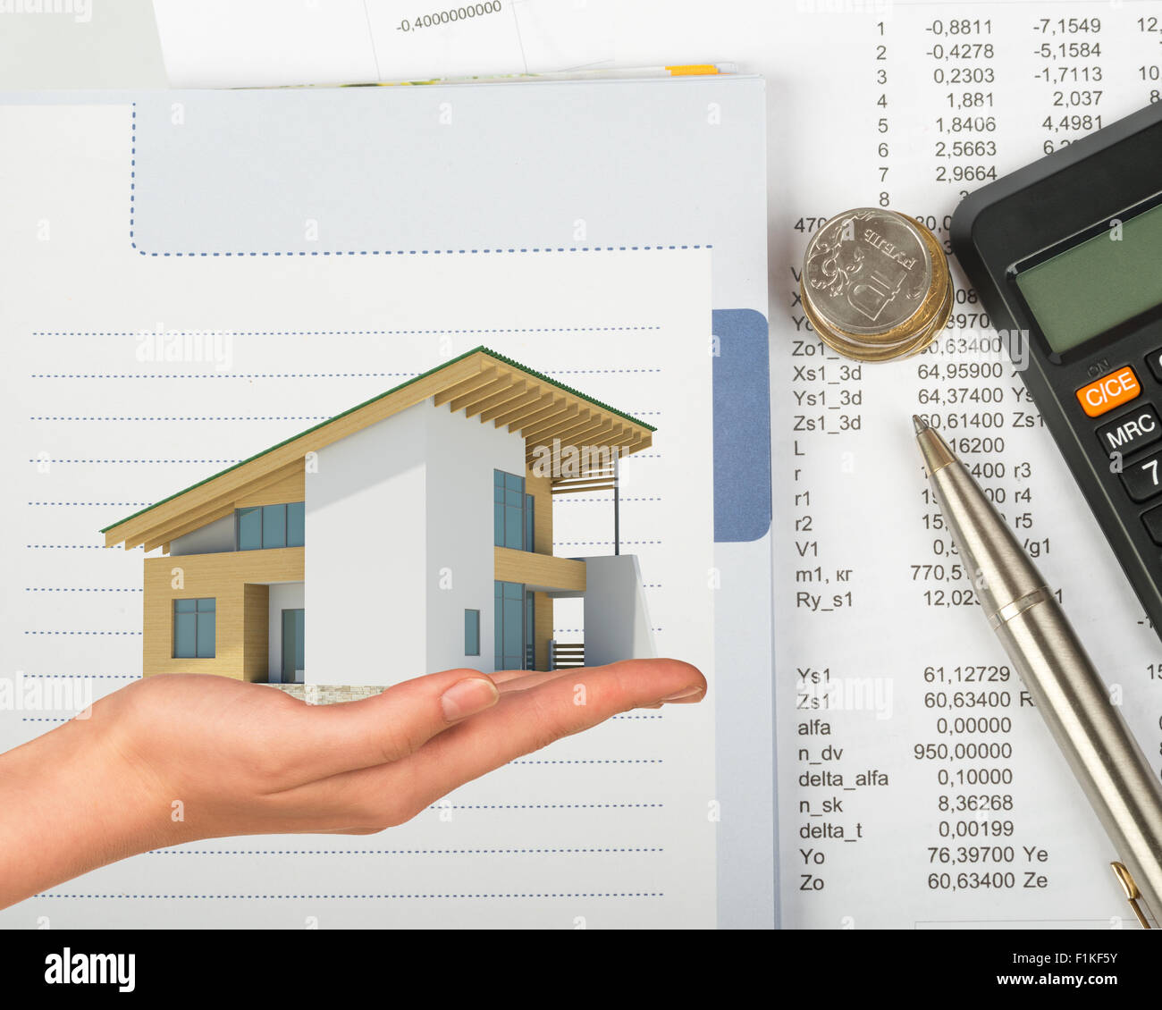 House coins calculator hi-res stock photography and images - Alamy
