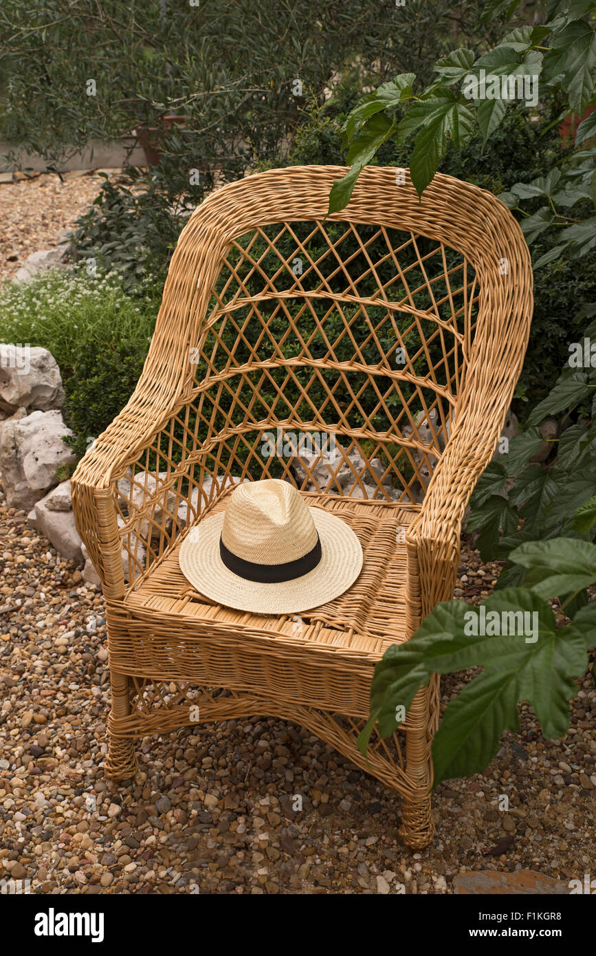 straw chair in a garden Stock Photo - Alamy