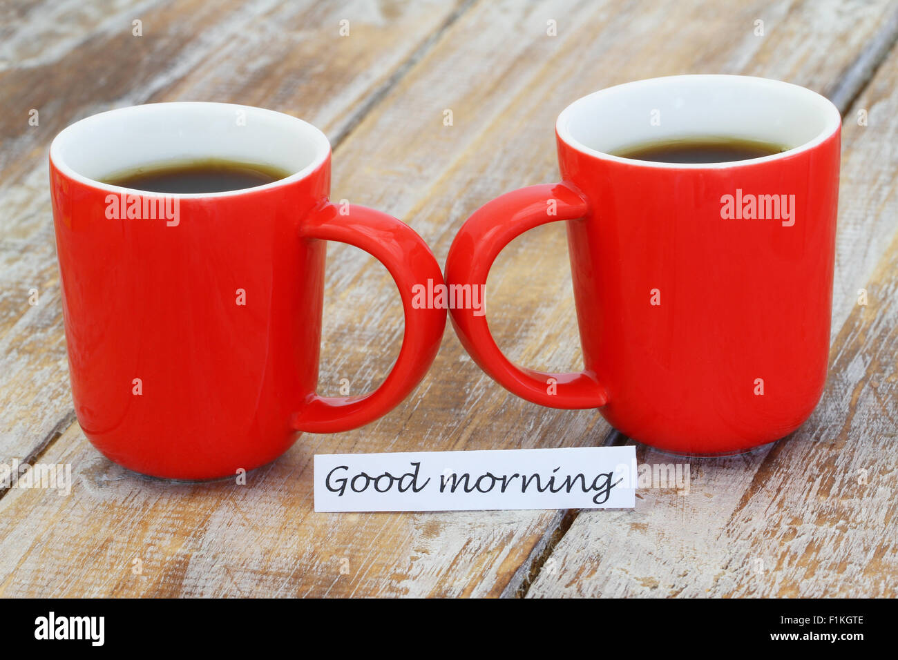Good morning card with two red mugs of coffee on rustic surface Stock ...