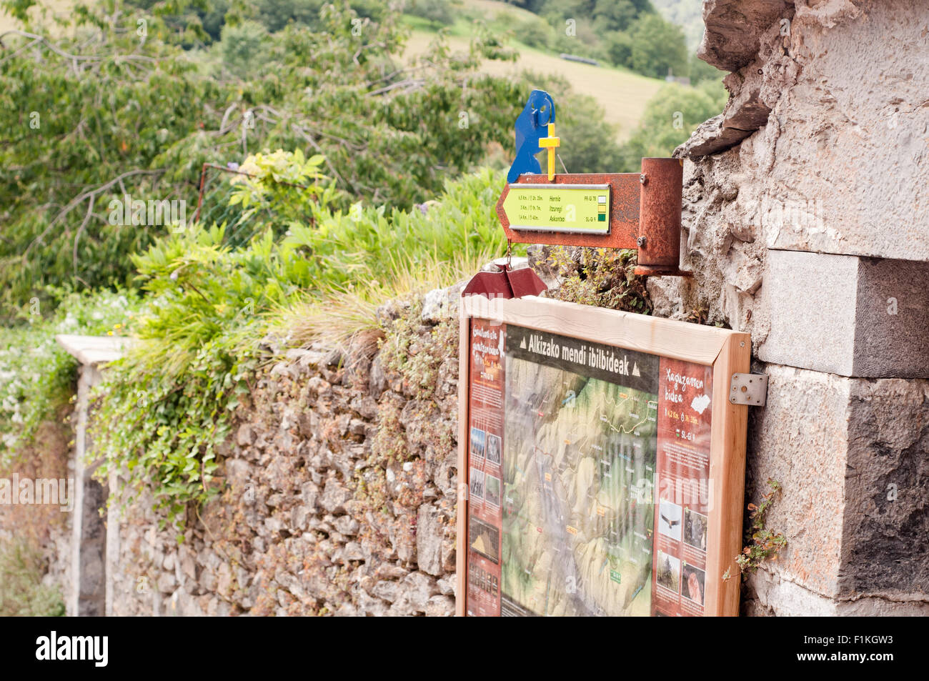 Information panel with metal designed signs for directions to various ...