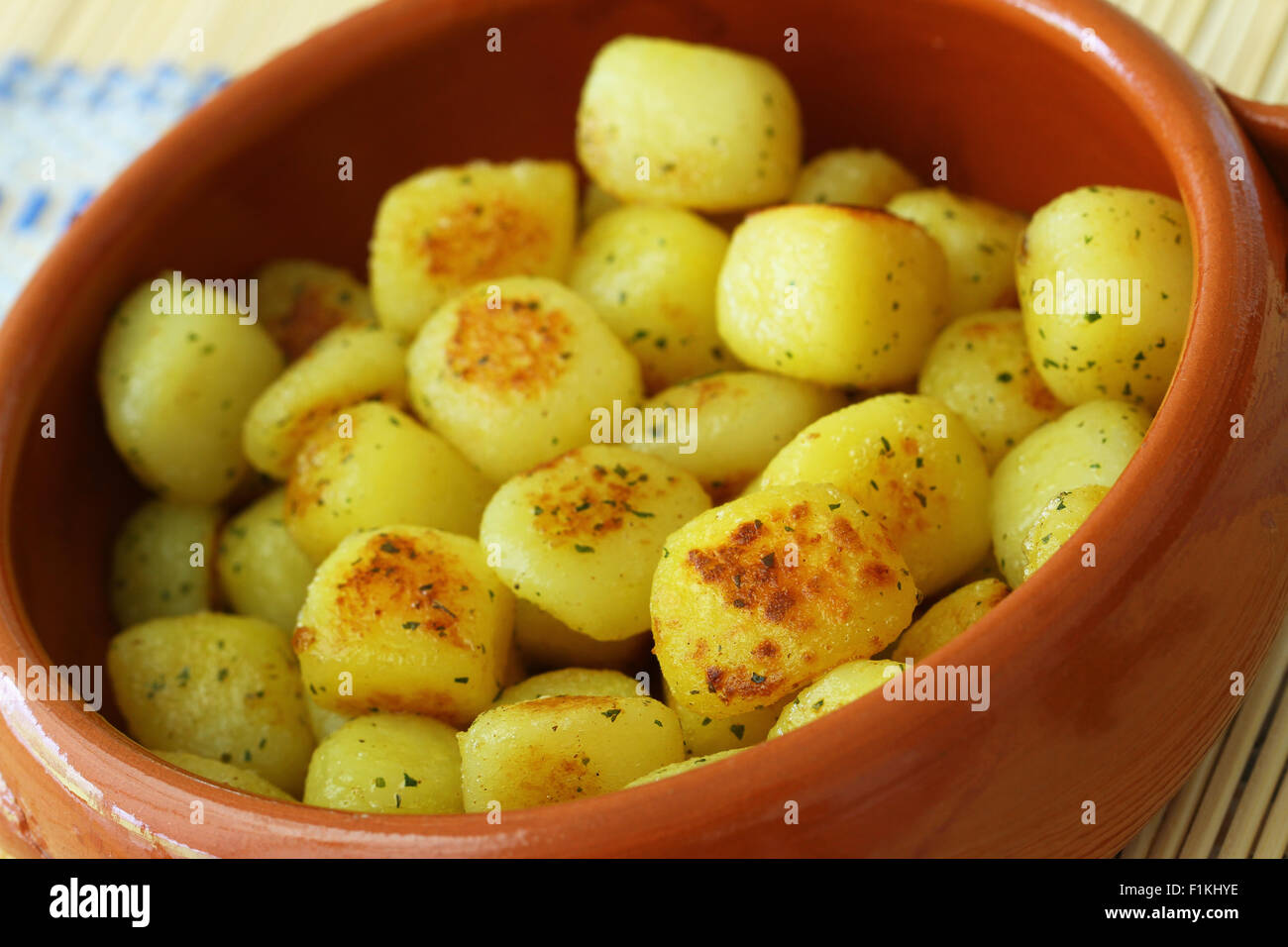 Roasted baby potatoes in traditional clay bowl, closeup Stock Photo - Alamy