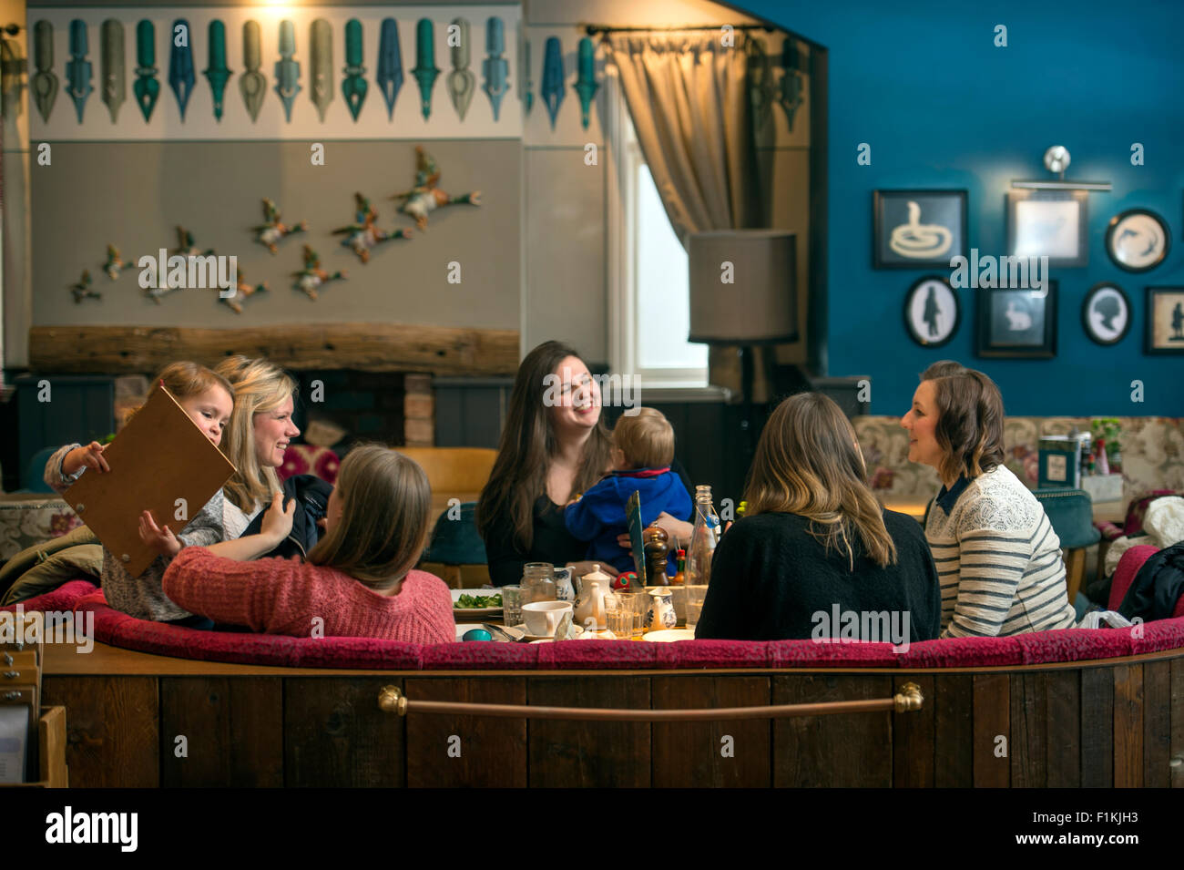 A group of mothers enjoy a Sunday morning brunch at a family friendly ...