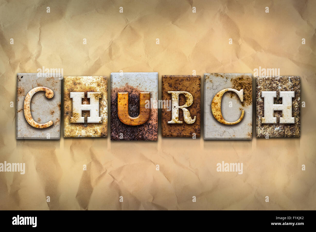 The word "CHURCH" written in rusty metal letterpress type on a crumbled ...