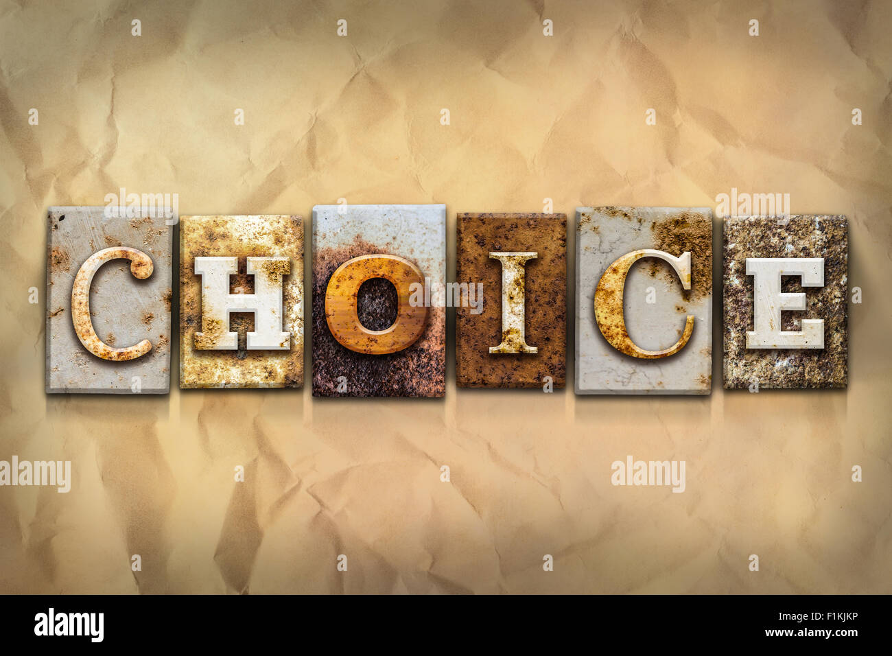 The word "CHOICE" written in rusty metal letterpress type on a crumbled ...
