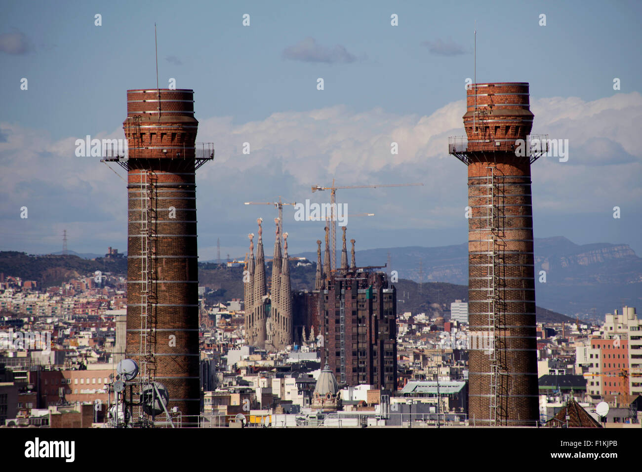The Fecsa chimneys in Barcelona with the Sagrada Familia cathedral ...