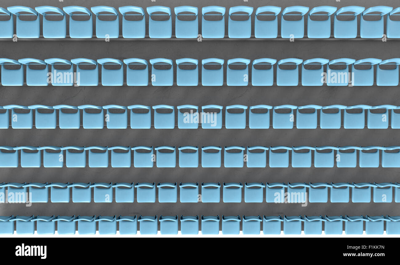 A section of stadium seating with blue chairs set in rows on a sloping ...