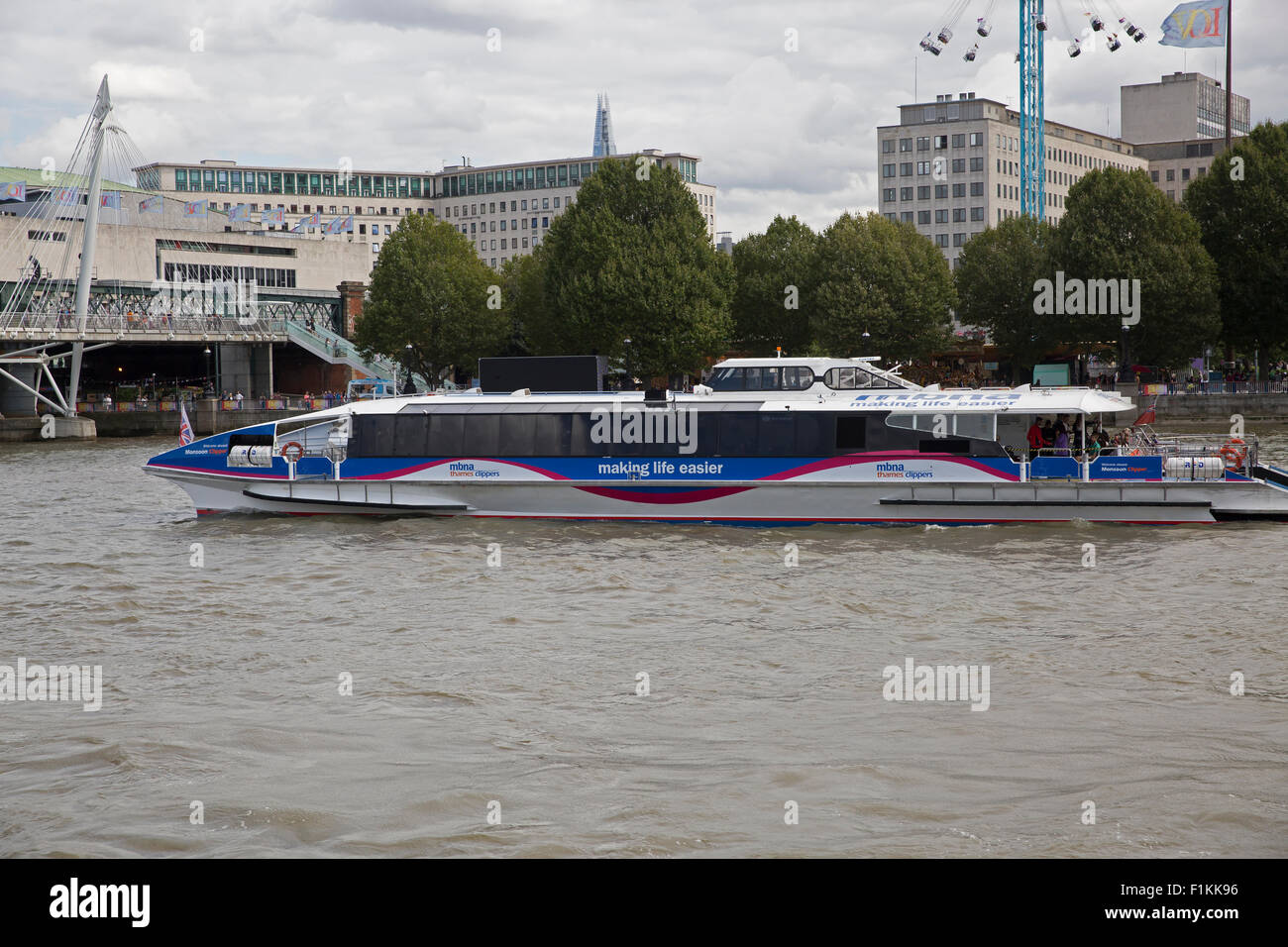 Thames clipper boat traveling up the River Thames in London Stock Photo ...