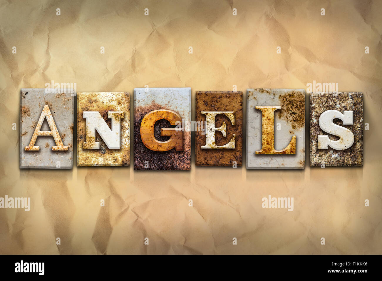 The word "ANGELS" written in rusty metal letterpress type on a crumbled ...