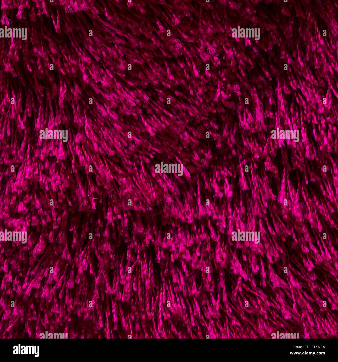 Closeup detail of pink carpet texture background Stock Photo - Alamy