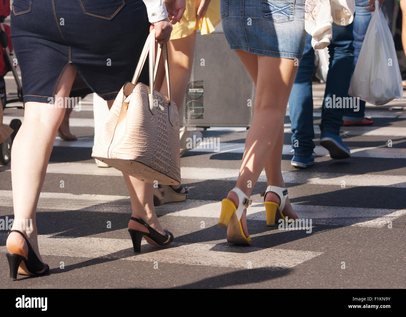 feet of the pedestrians crossing on city street Stock Photo - Alamy