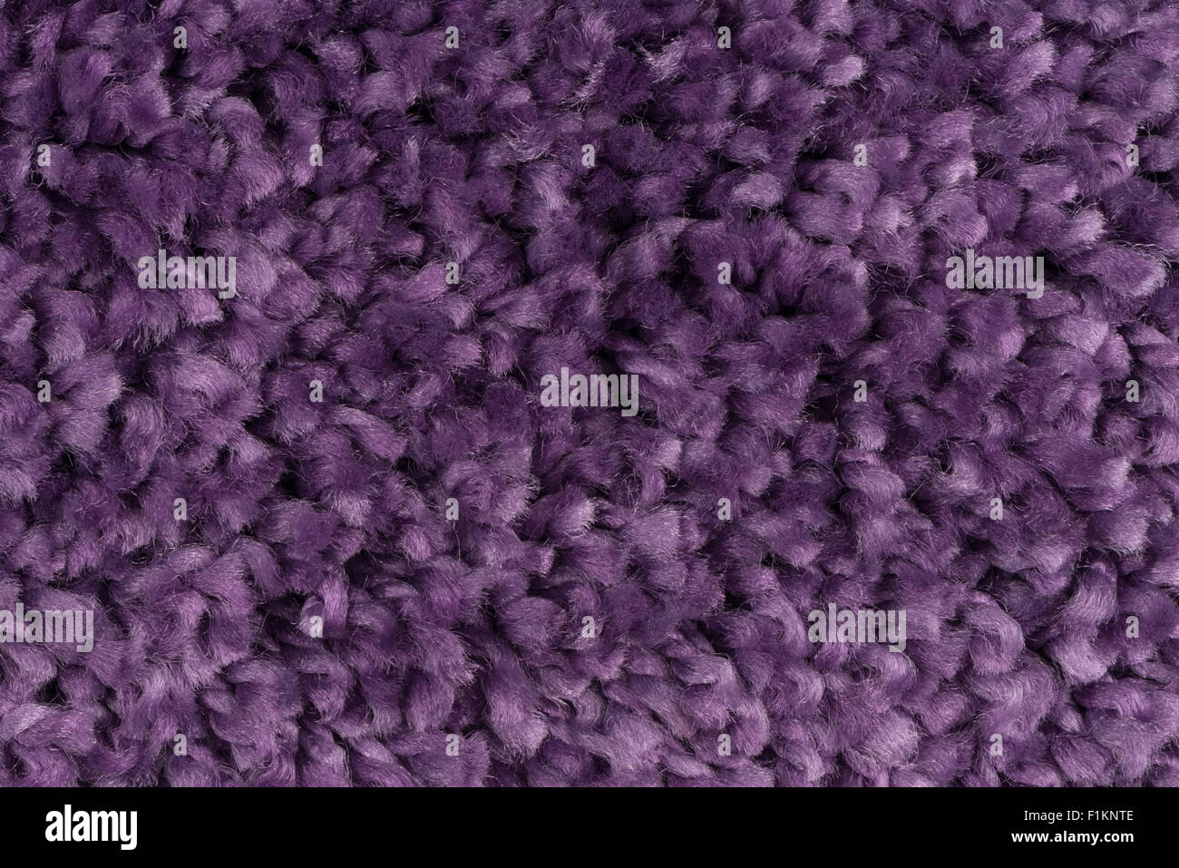 Closeup detail of purple carpet texture background Stock Photo - Alamy
