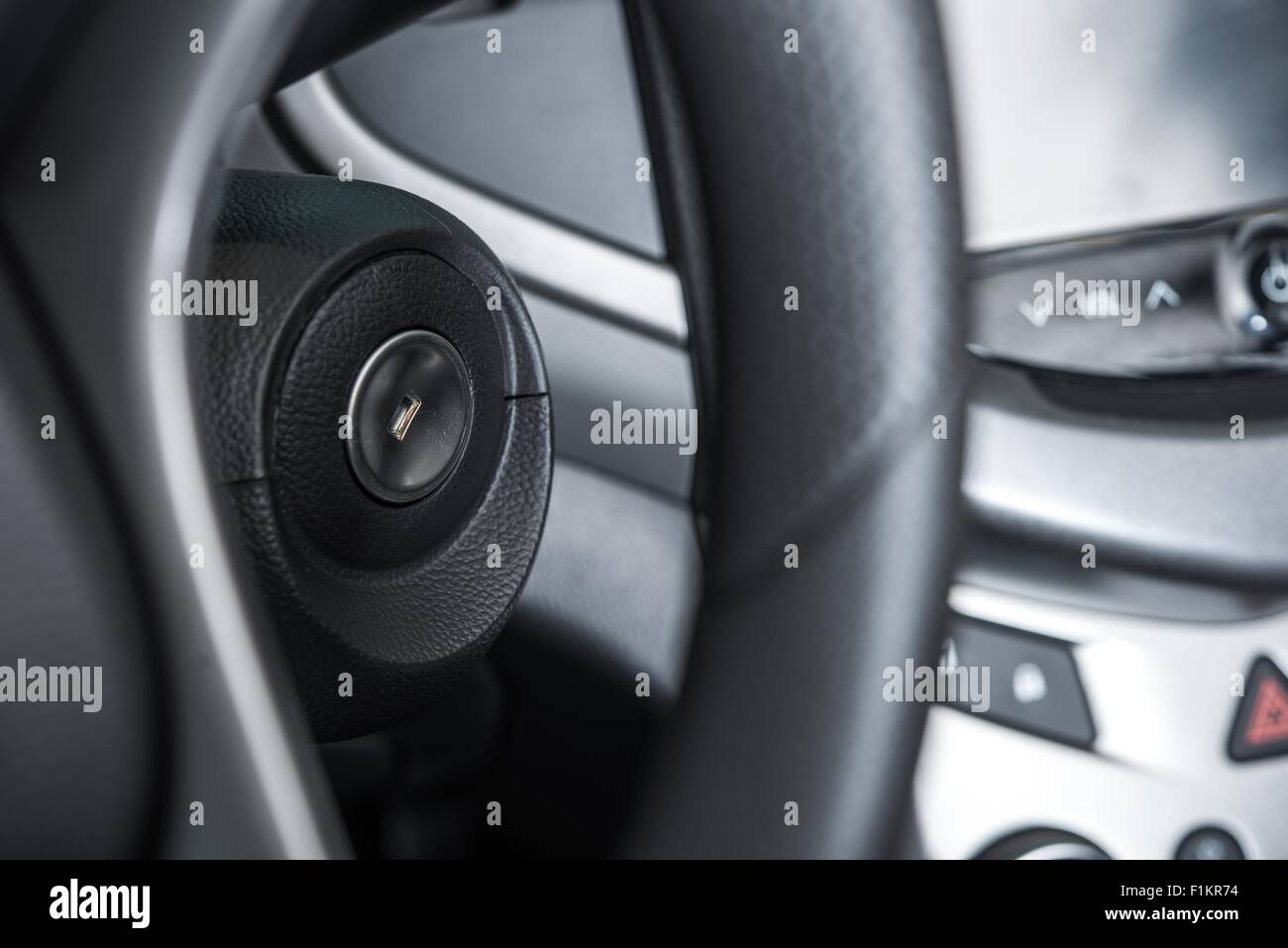 Modern Car Ignition Keyhole Closeup and Steering Wheel Stock Photo - Alamy