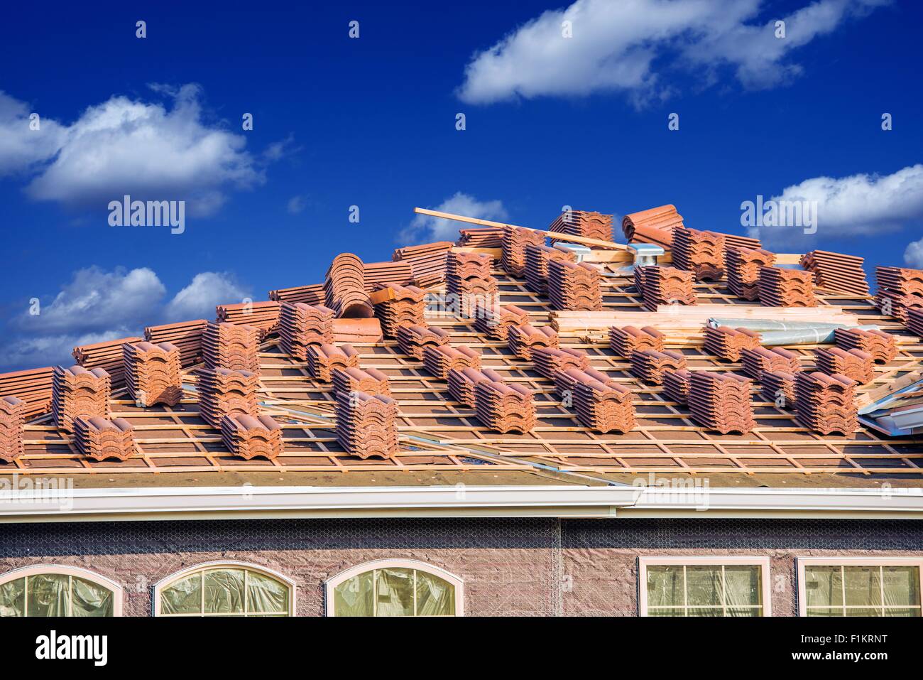 Ceramic Roof Slates Works. Residential Roof Closeup. Piles of Ceramic ...