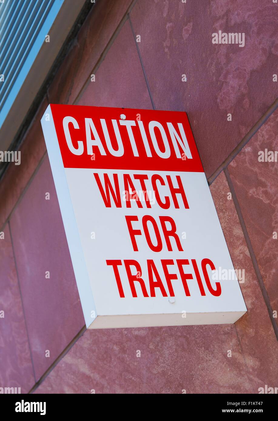 Caution, Watch For Traffic Wall Sign. Warning Sign Stock Photo - Alamy