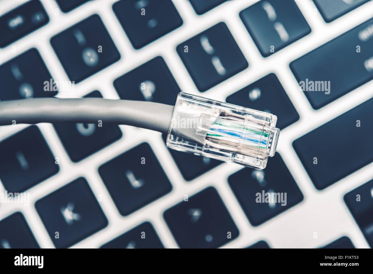Network Concept with RJ 45 Network Cable and Computer Keyboard ...