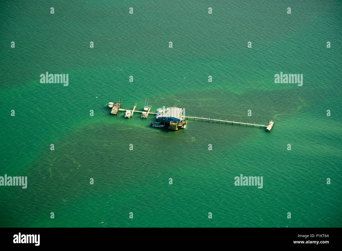 Aerial view of stilt houses and pier in the Atlantic ocean, Stiltsville ...