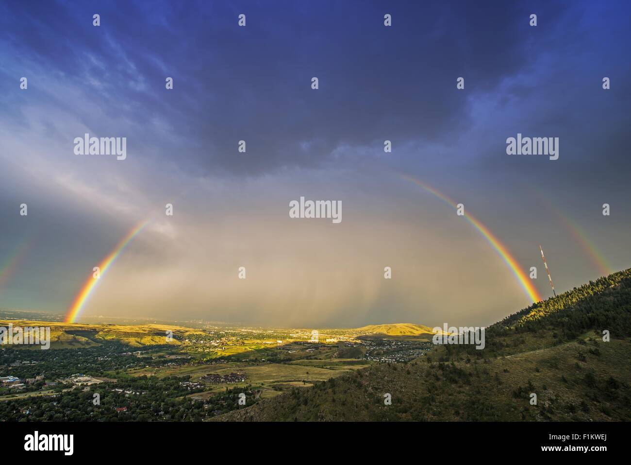 Rainbow Over Denver. Colorado Stormy Sky with Colorful Full Rainbow ...