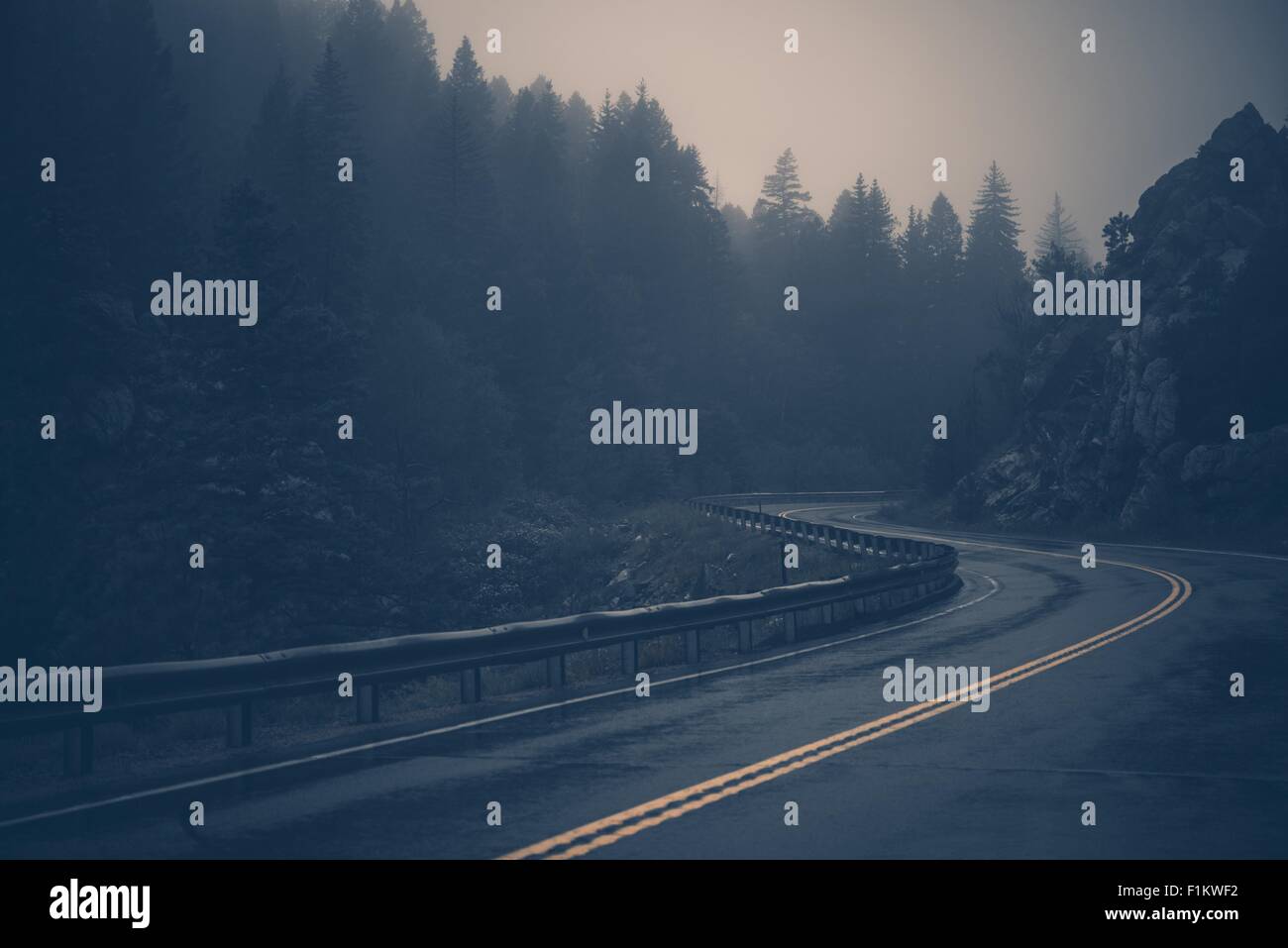 Foggy Curved Mountain Road at Evening. Faded Blue Color Grading Stock ...