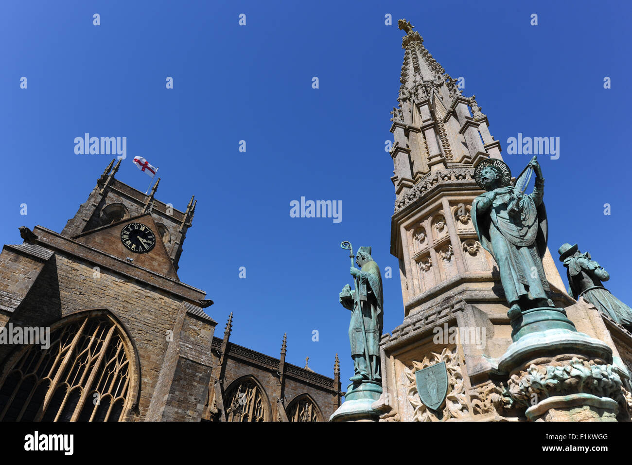 Sherborne Abbey with clock & flag flying, and Digby Memorial in the ...