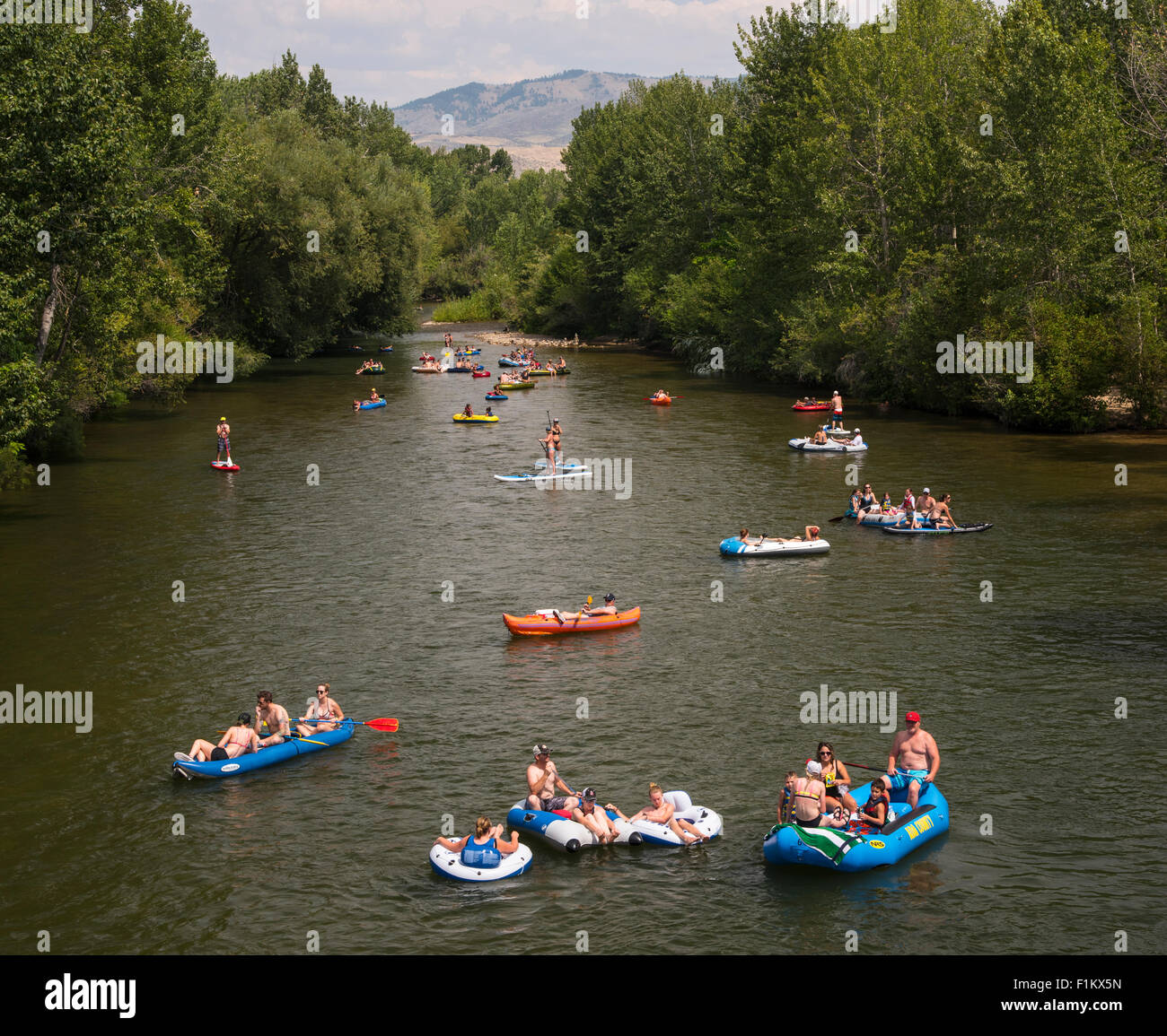People floating the Boise River on a summer day. Boise Rver Greenbelt ...