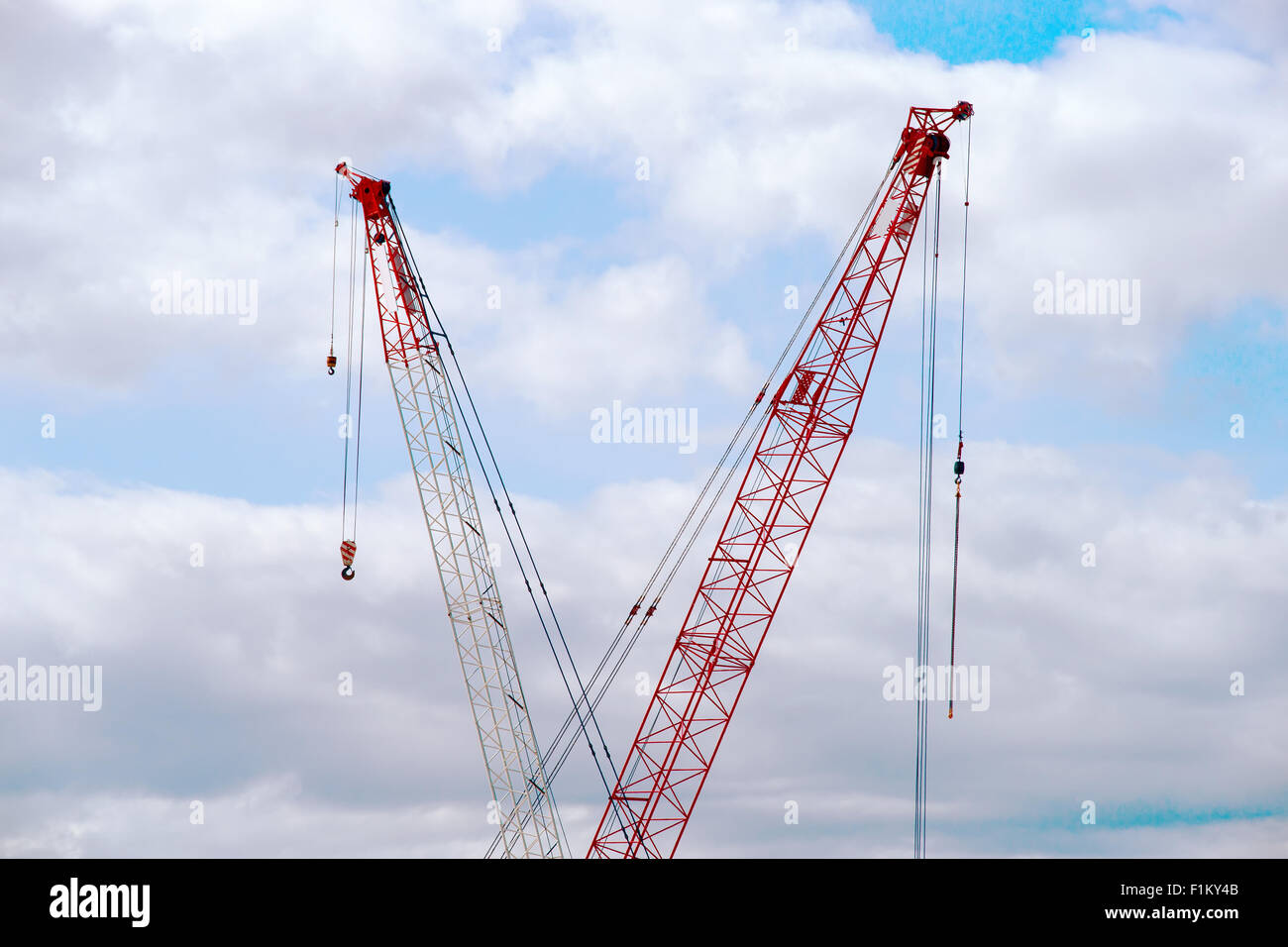 Landskape with two crossing cranes and the sky Stock Photo - Alamy
