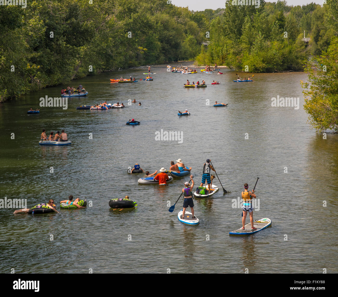 People floating the Boise River on a summers day. Boise Rver Greenbelt ...